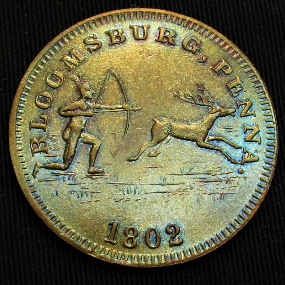 Unknown centennial copper token with blue on the fields against the ...