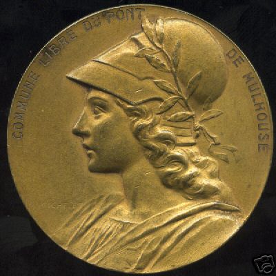 Can anyone translate the French inscriptions on the pictured medal ...