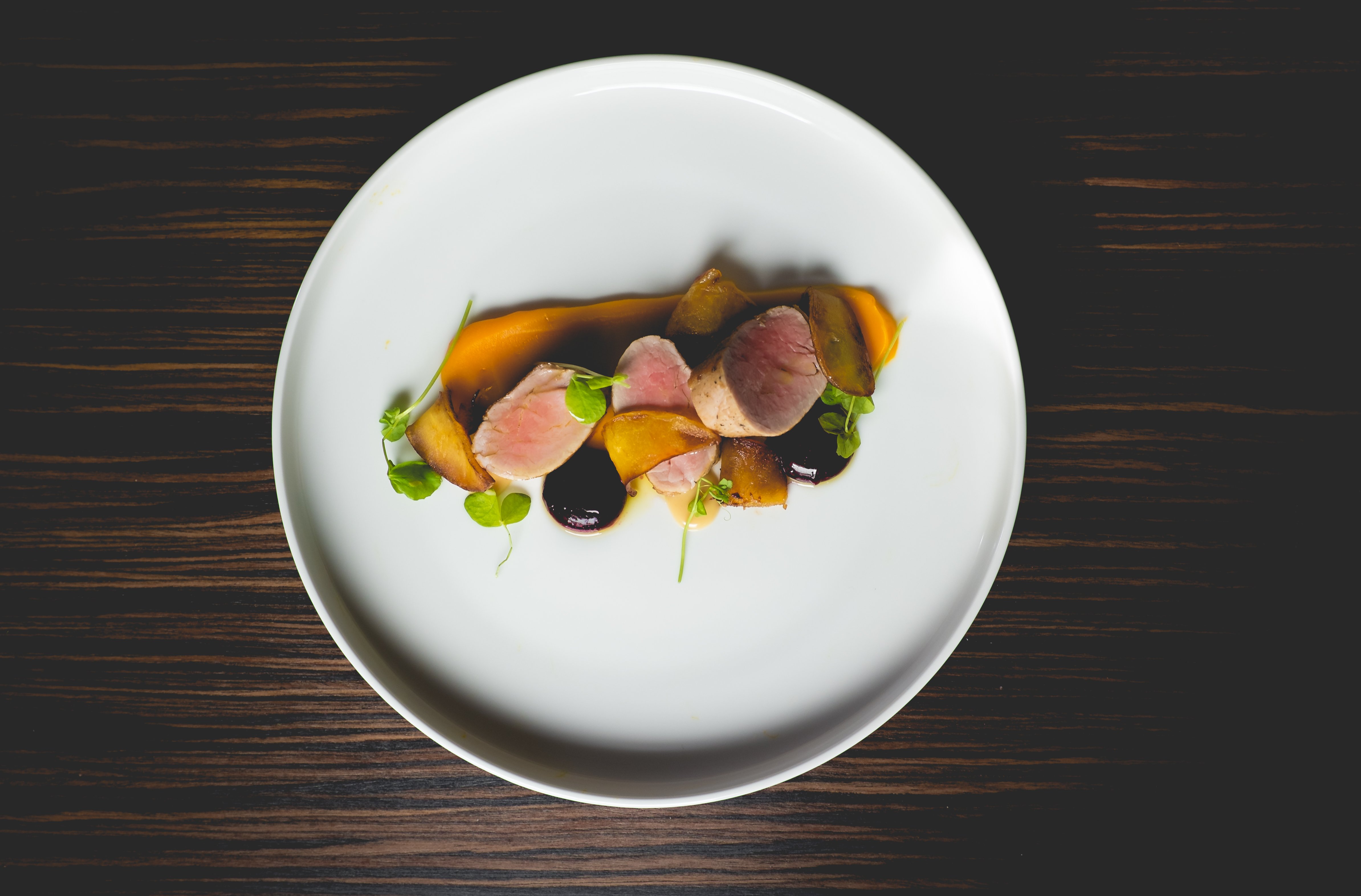 Pork tenderloin, caramelized apples, beet spheres, butternut squash ...